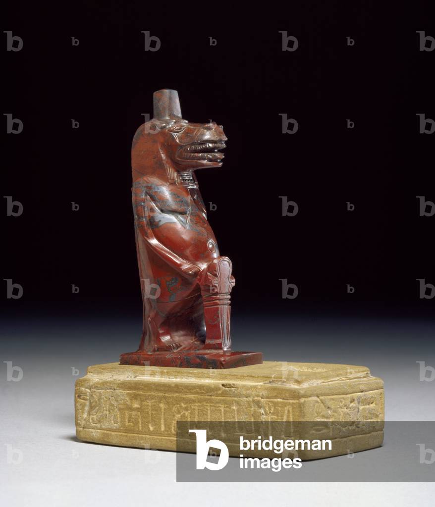 Image of Hippopotamus goddess Taueret, holding a plait of rolled ...