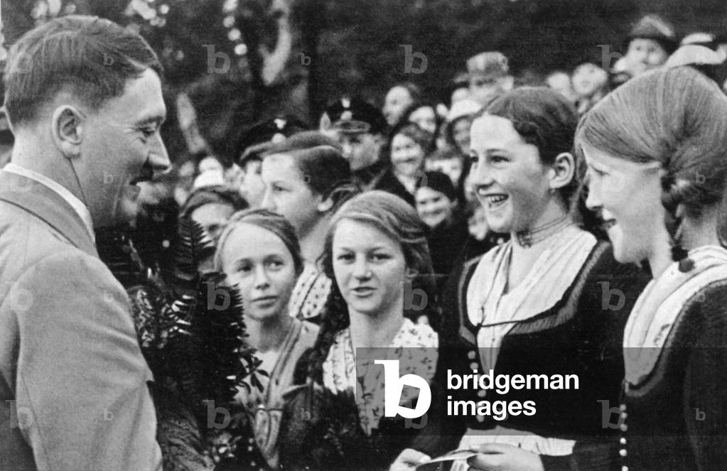 Image of Hitler meeting happy young girls (b/w photo)