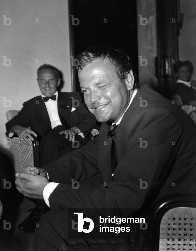 Image of American film director Orson Welles, wearing a tuxedo and a