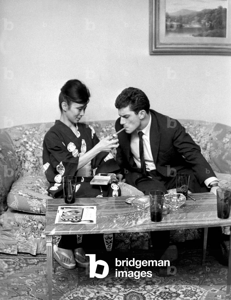 Image of Luigi Tenco presented a copy of his record to the