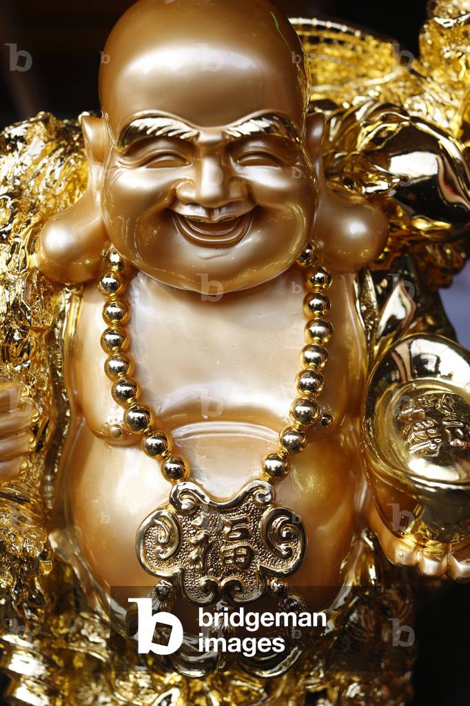 Image of Statue of Ong Dia, the round, happy God of the