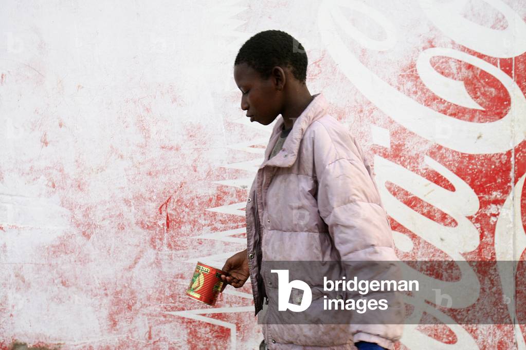 Image of Talibe Coran schoolboy with his alm box, Saint Louis, Senegal