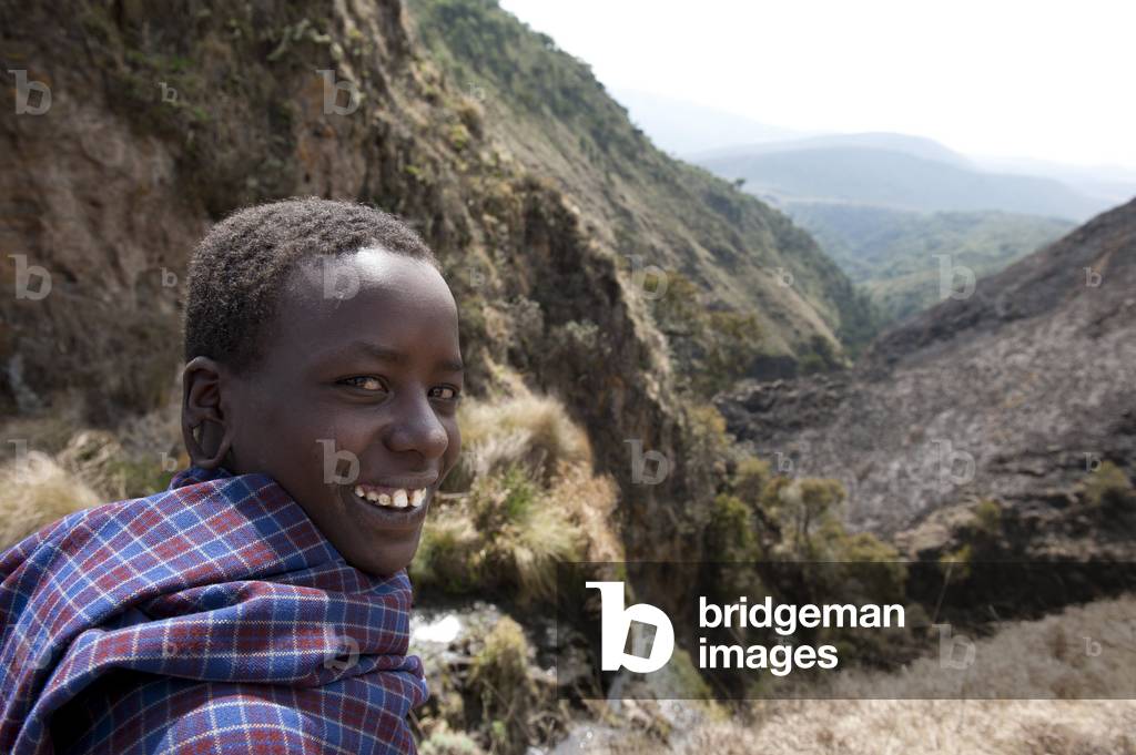 Image of Ethnology; portrait; smiling Maasai boy; gorge at the Olmoti ...