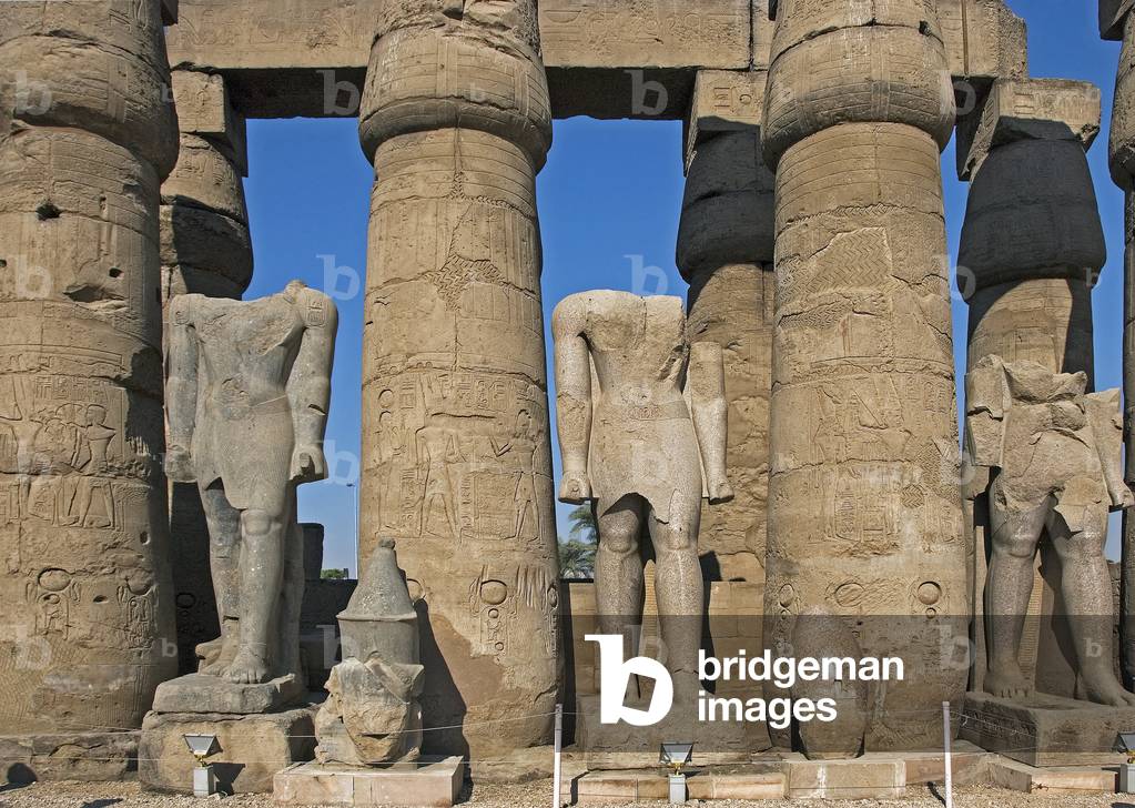 Image of Egyptian antiquite: colonnade and statues. Temple of Luxor ...