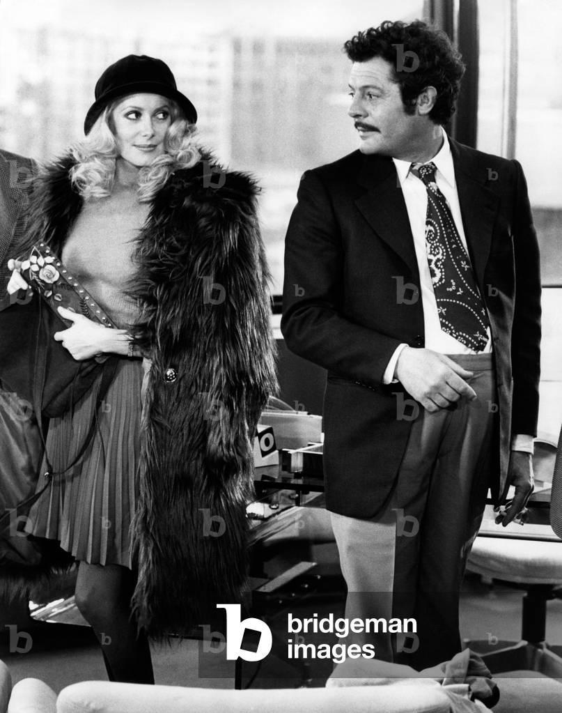 Image of Catherine Deneuve and Marcello Mastroianni exchange a knowing ...