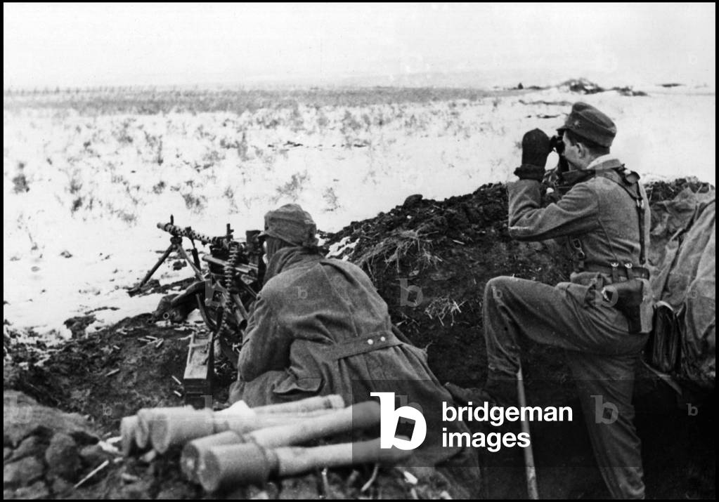 Image of Two German soldiers equipped with grenades and a MG 34-41
