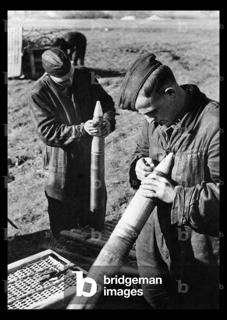 Image of Two German soldiers preparing anti-aircraft shells at a ...