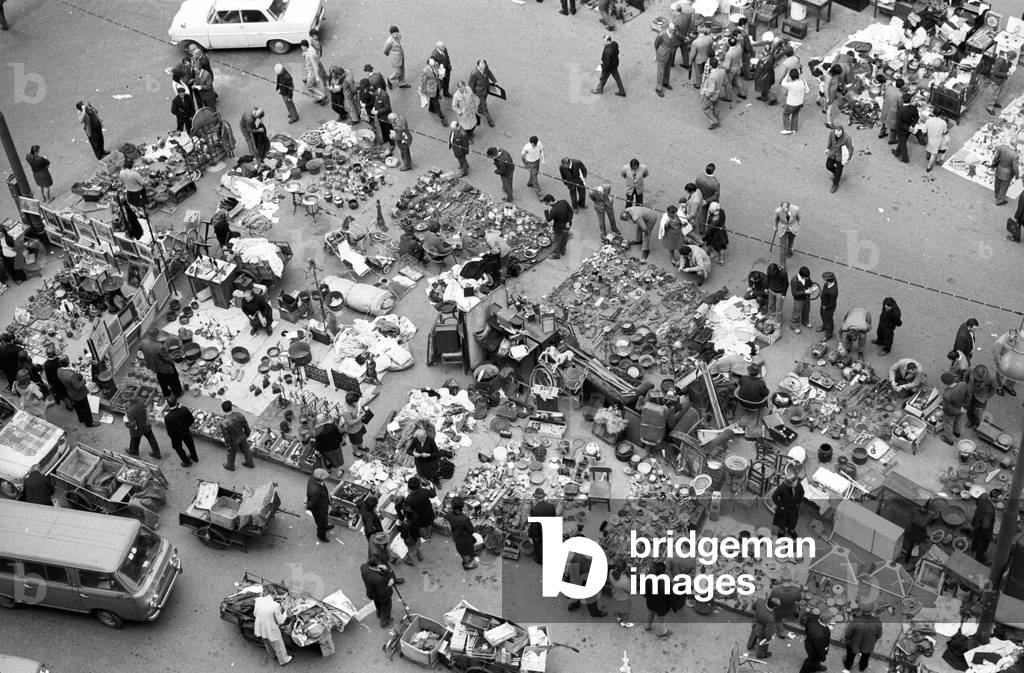 Image of Some people looking at the objects on display at an