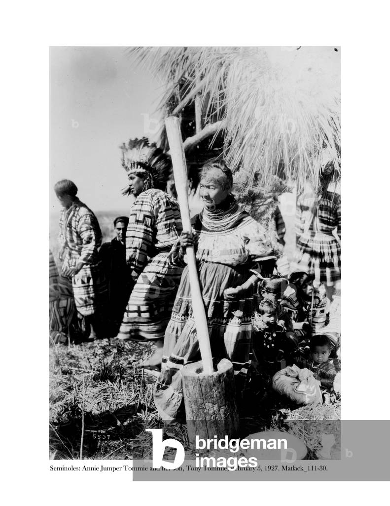 Image of Annie Jumper Tommie using a mortar and pestel to make by ...
