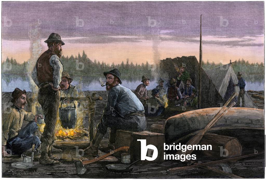 Image of Loggers camping on a lumber raft on a river in
