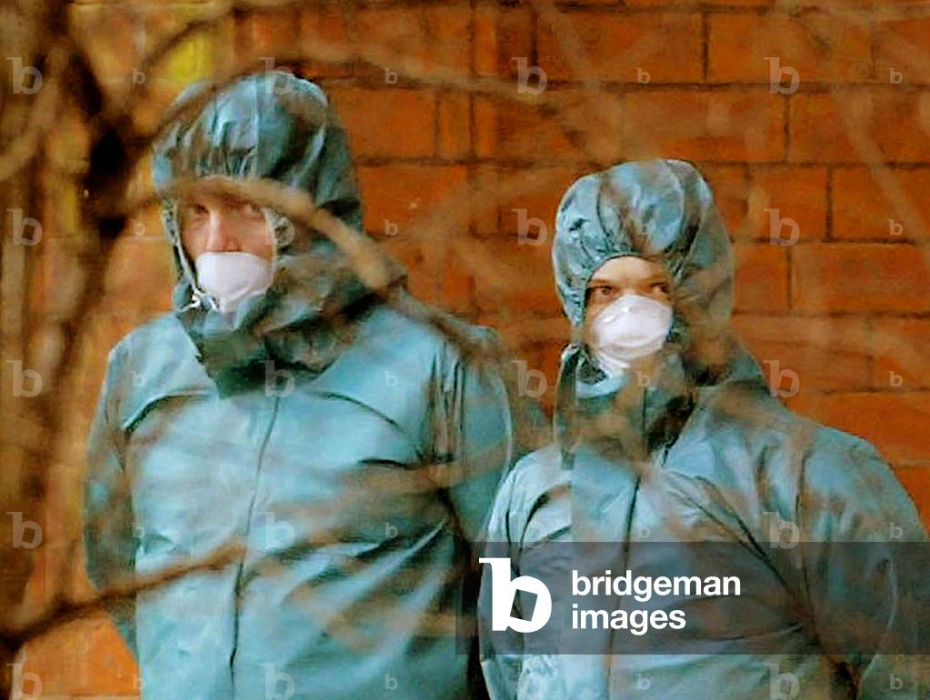 Image of POLICE FORENSIC OFFICERS STAND OUTSIDE BUILDING WHERE ...