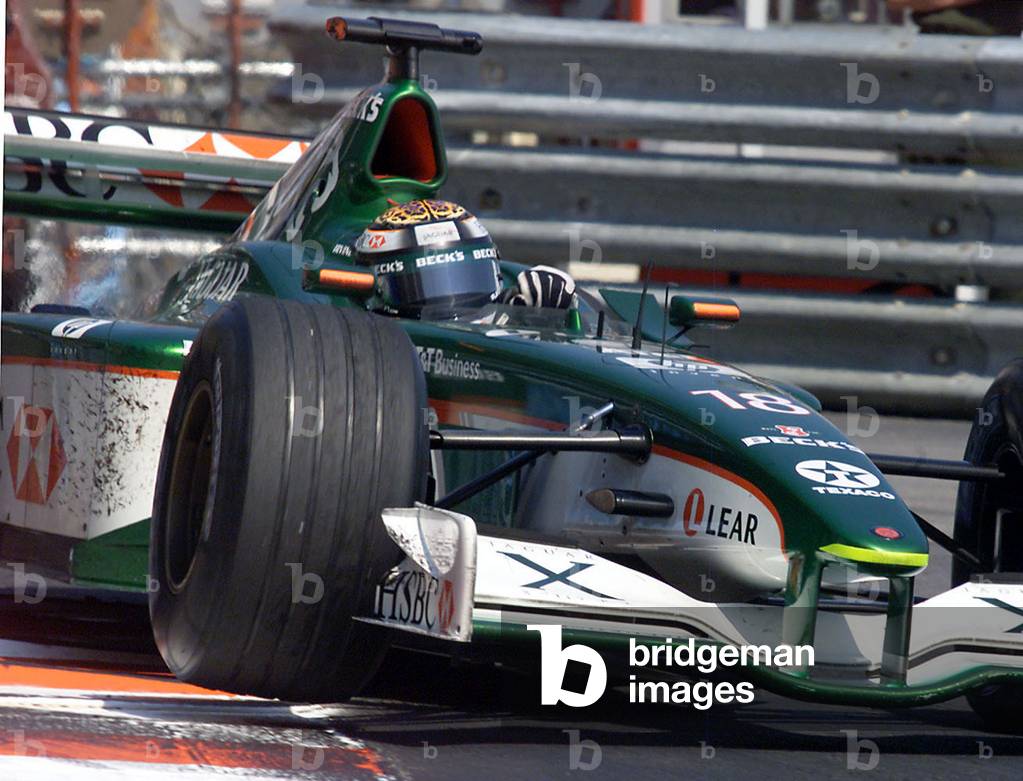Image of Irish Formula One driver Eddie Irvine takes a curve on