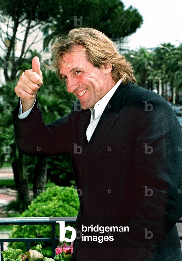 Image of French actor Gerard Depardieu puts his thumb up during a