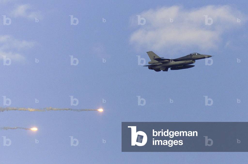 Image of A Taiwanese F-16 fighter releases two flares during an anti ...