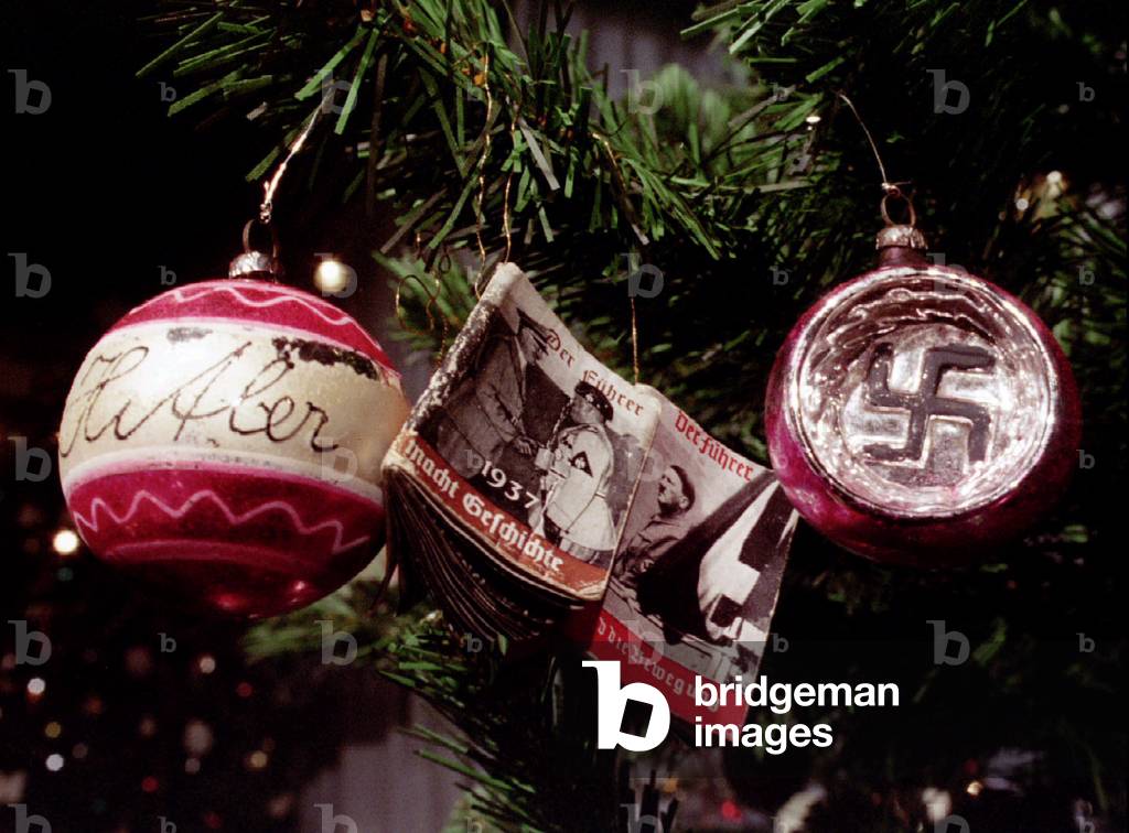 Image of A Christmas tree decorated with NAZI symbols, a Hitler picture