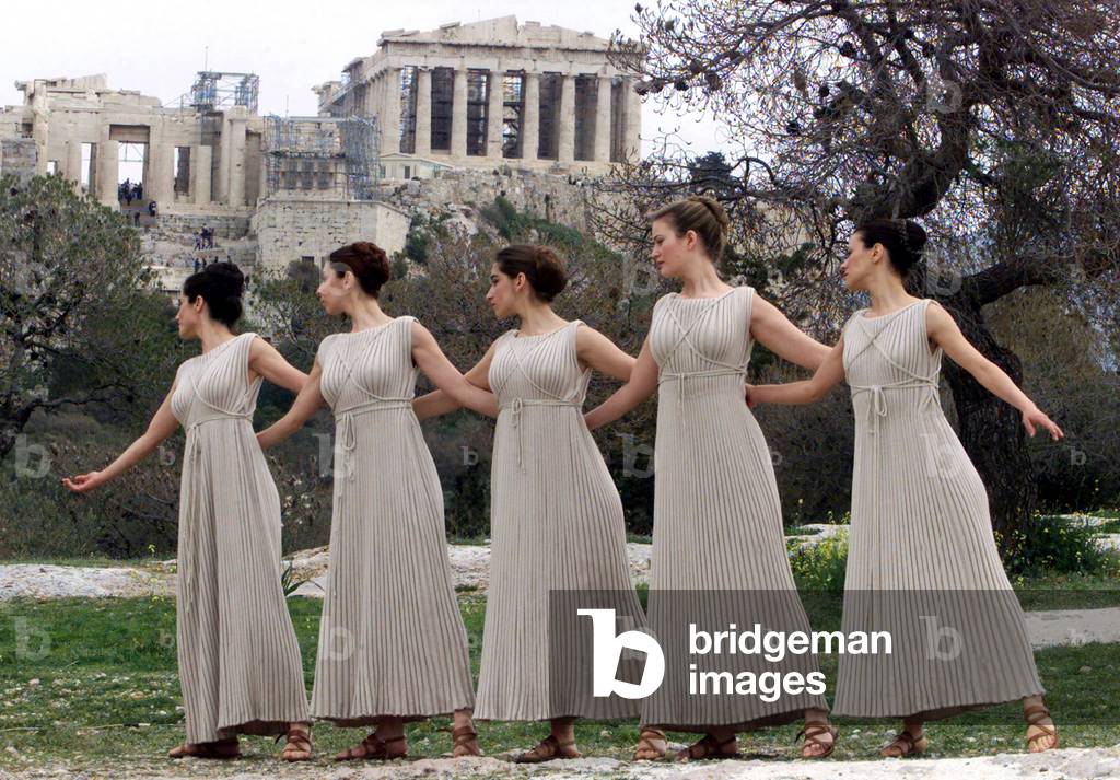 Image of Greek actresses, playing the role of priestesses, dance on the