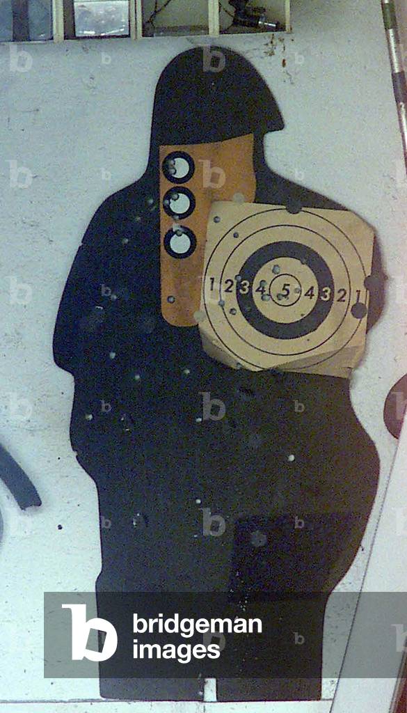 Image of TARGET IS SEEN IN THE CARPORT OF HOUSE FROM WHERE