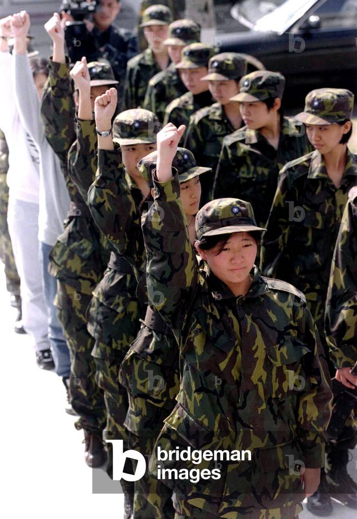 Image of Taiwanese female students raise their hands as they attend ...
