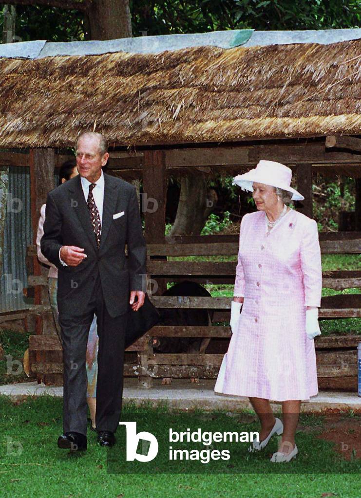 Image of Queen Elizabeth II and her husband Prince Philip walk out
