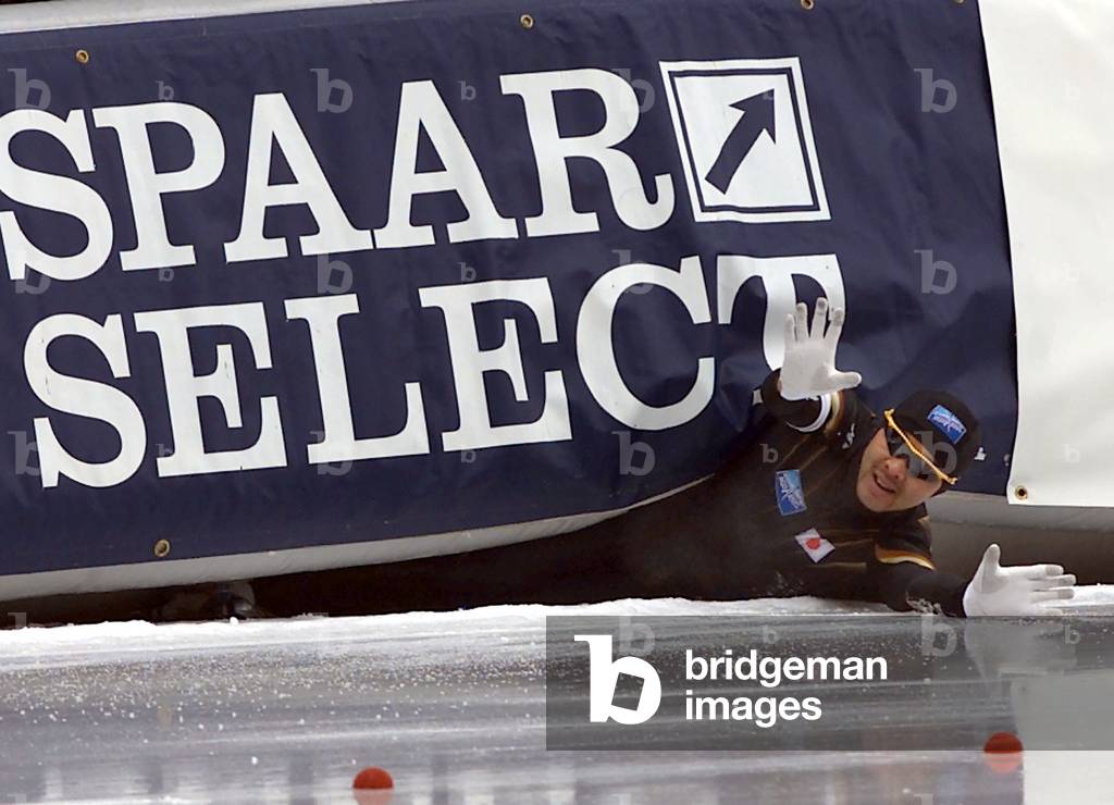 Image of JAPANS MANABU HORII CRASHES INTO AN ADVERTISEMENT BOARD AT THE
