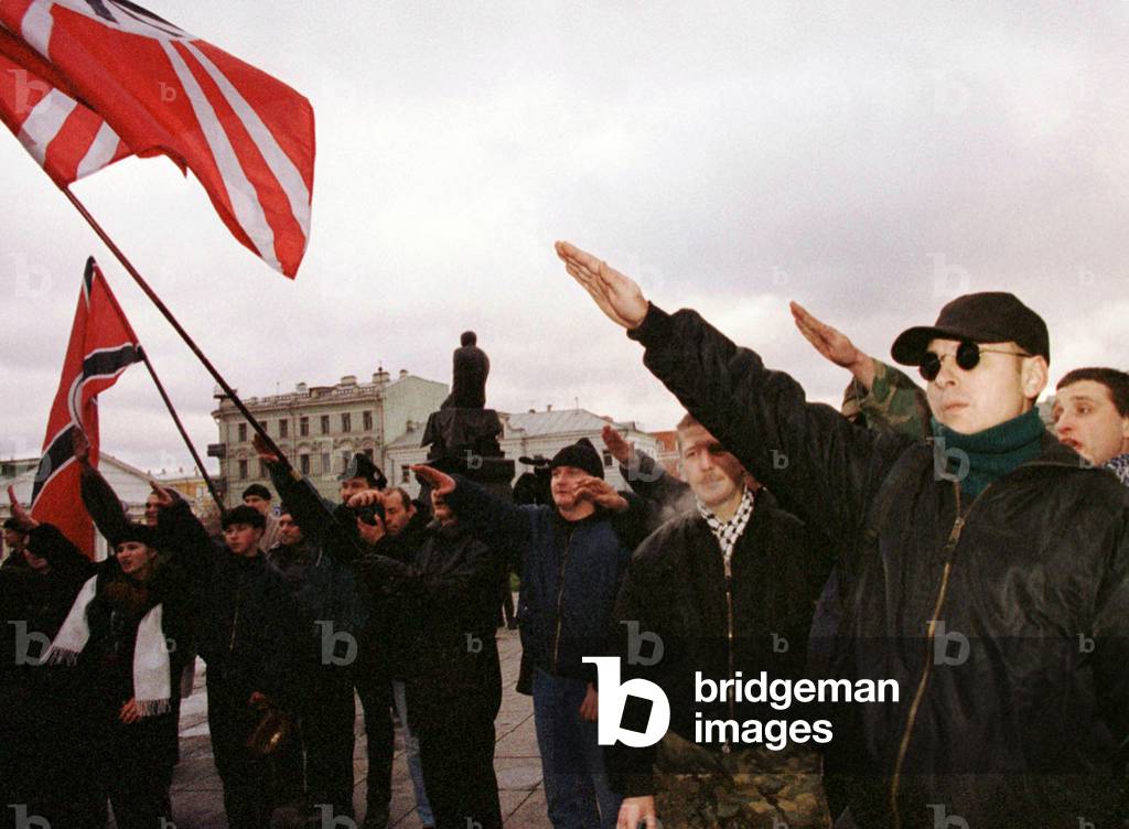Image of Russian ultranationalists hold flags and make Nazi salutations ...