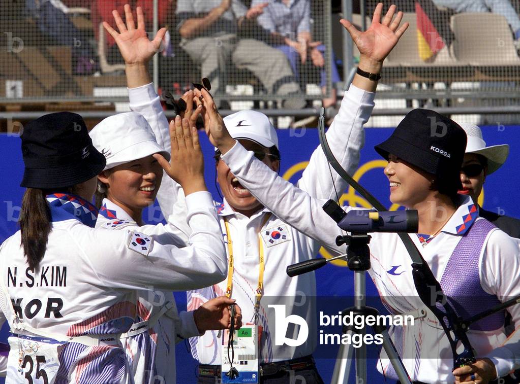 Image of GOLD MEDAL TEAM ARCHERS KIM SOO-NYUNG, YUN MI-JIN, AND KIM