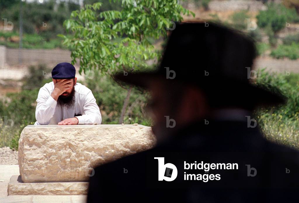 Image of Ultra-religious Jewish men pray June 3 at the grave of