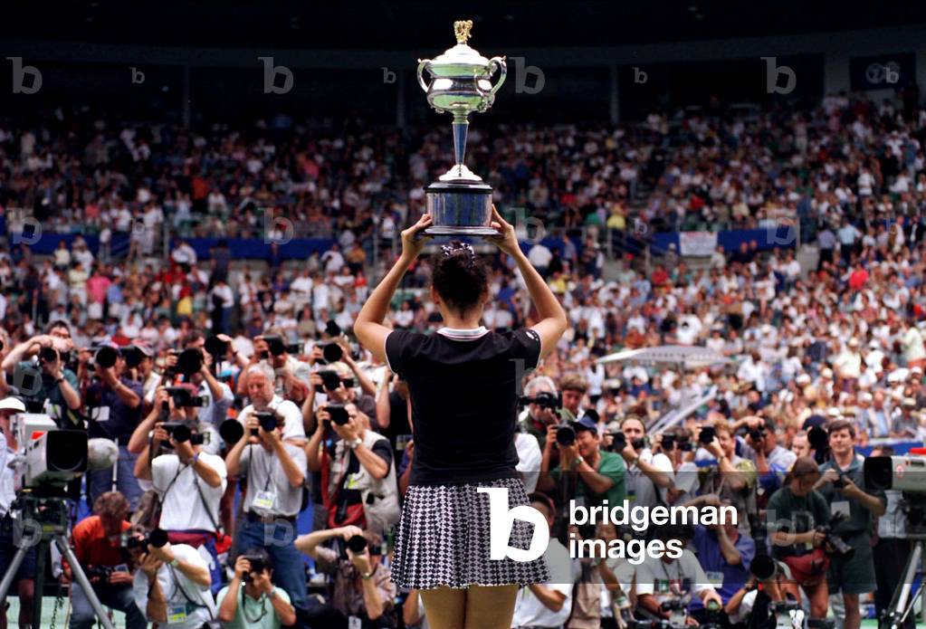 Image of World number one Monica Seles of the U.S. holds aloft