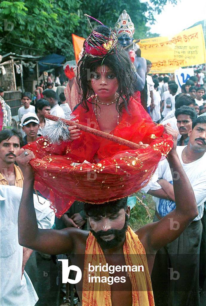 Image of A YOUNG HINDU BOY DRESSED AS LORD KRISHNA IN DHAKA,