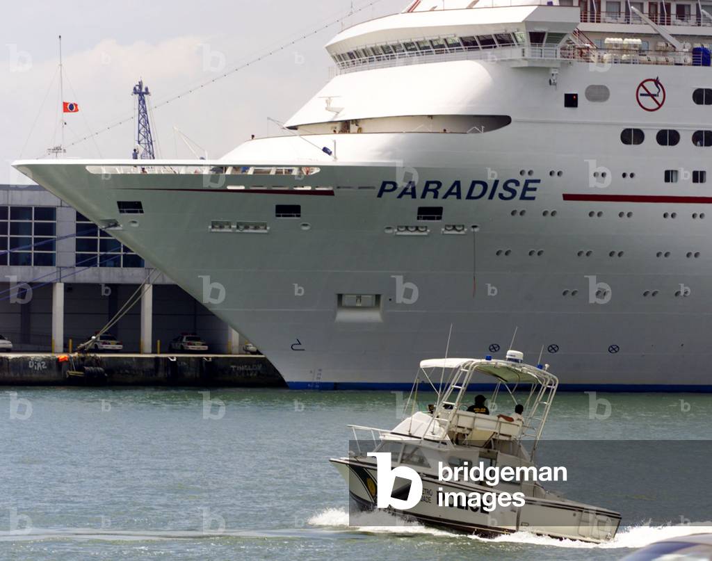 Image of POLICE PATROL THE WATERS NEAR CRUISE SHIP AT THE PORT