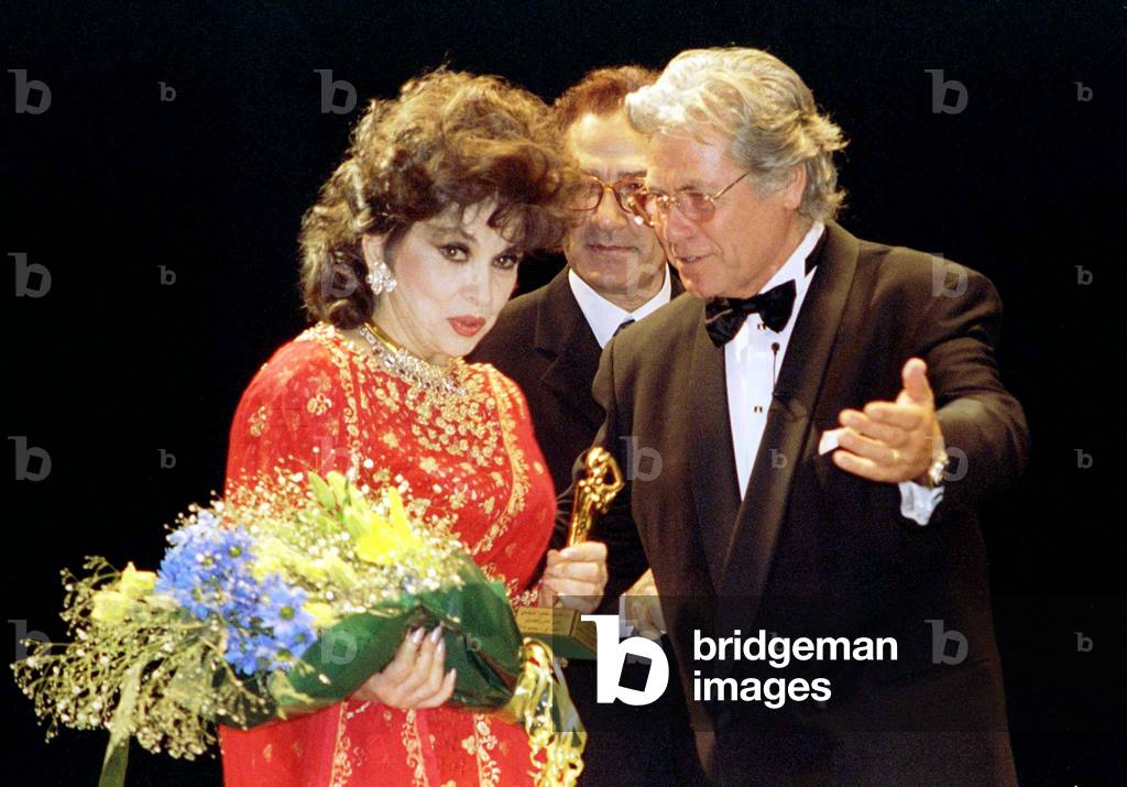 Image of Egyptian actor Hussein Fahmy (R) welcomes the famous Italian ...