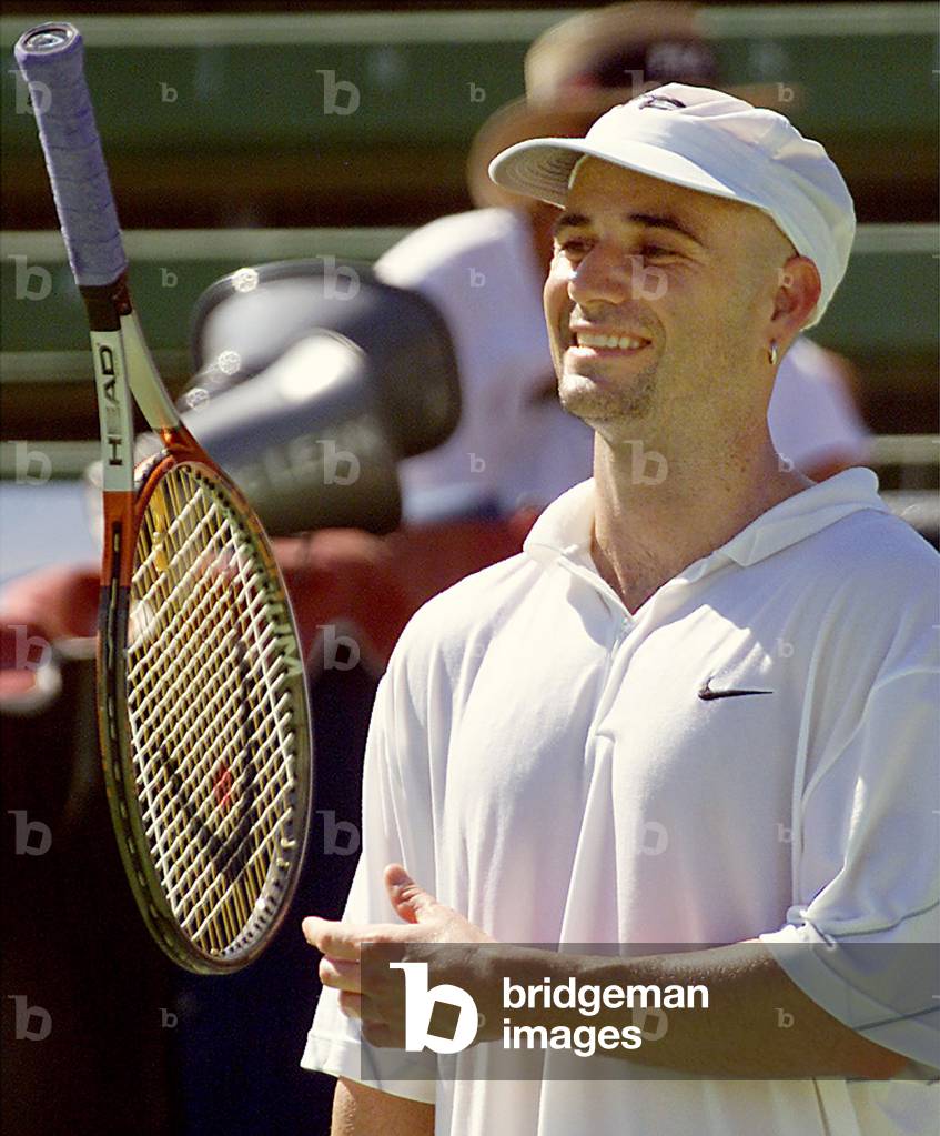 Image of ANDRE AGASSI FROM THE US THROWS RACQUET DURING MATCH AGAINST