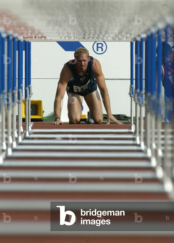Image of PAPPAS OF THE U.S. TAKES HIS MARKS BEFORE HIS 110
