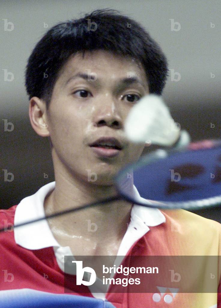 Image of INDONESIA'S AGUSTINUS EYES THE SHUTTLECOCK DURING THE ...