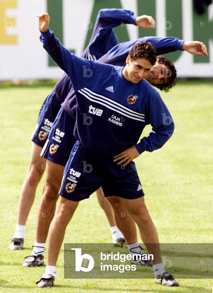 Image of Spain's striker Raul Gonzalez (front) and Miguel Angel Nadal carry