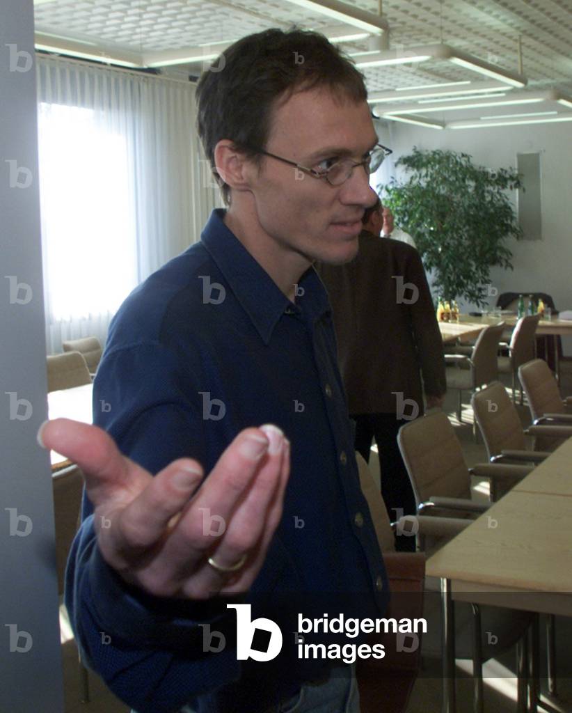 Image of GERMAN TRACK ATHLETE DIETER BAUMANN ENTERS A COURTROOM IN MUNICH,