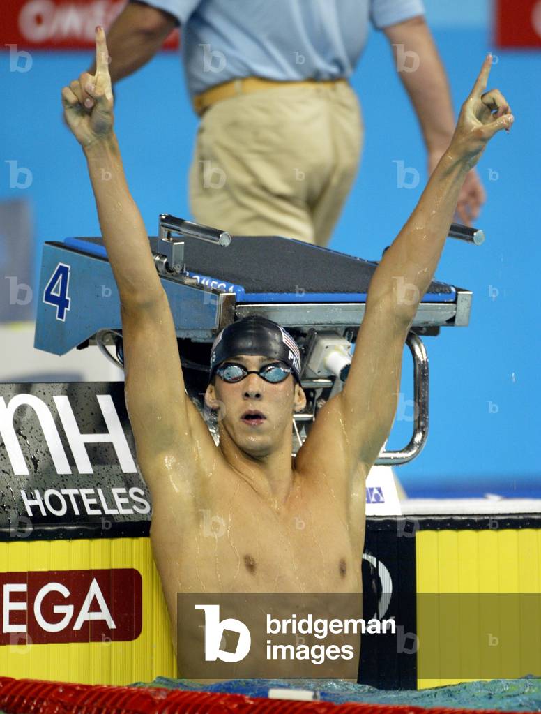 Image of USA'S MICHAEL PHELPS CELEBRATES AFTER WINNING TO SET A WORLD