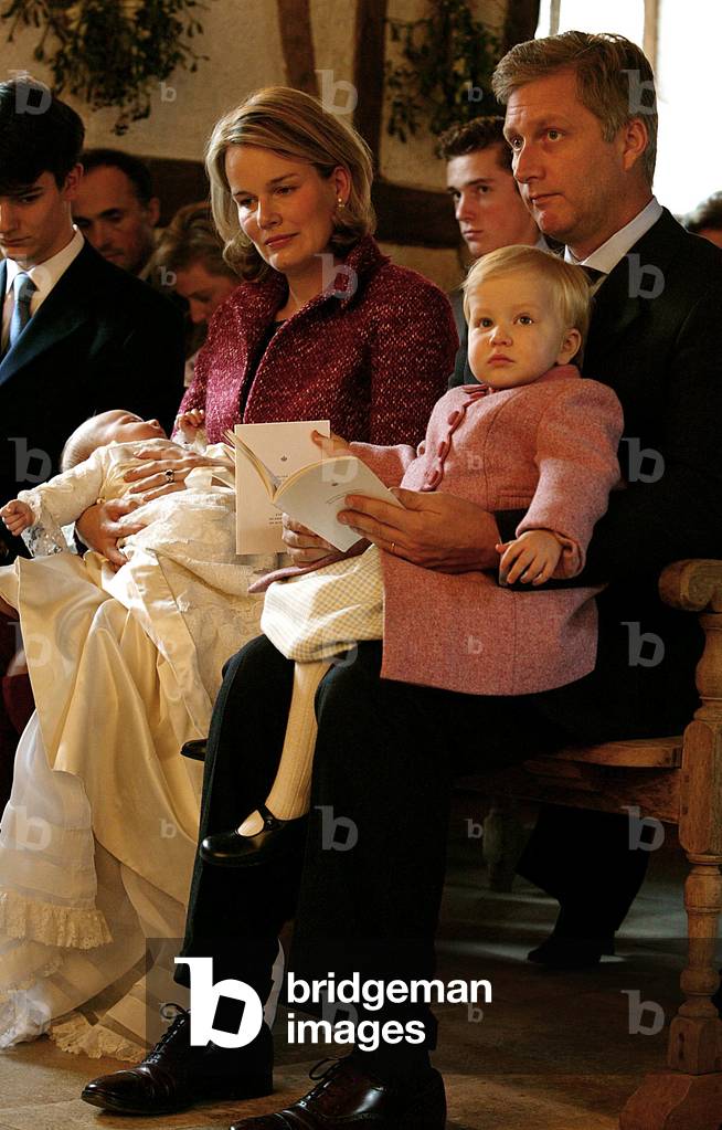 Image of BELGIAN PRINCE GABRIEL LIES IN THE ARMS OF HIS MOTHER