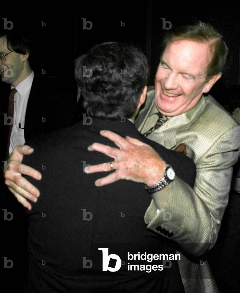 Image of TED ROGERS EMBRACES METRONET CEO YOUNG, 1999-03-04 (photo)