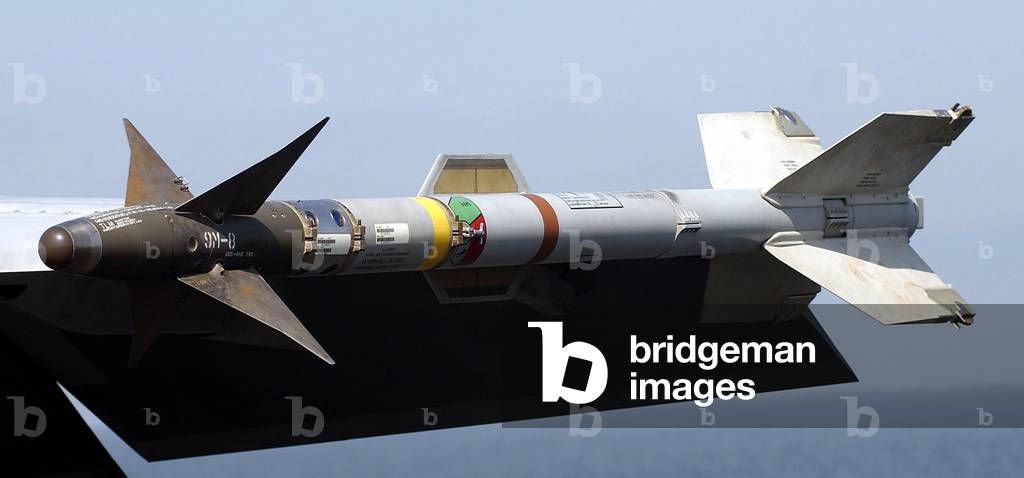 Image of An AIM-9 Sidewinder air-to-air missile attached to and F/A-18 ...