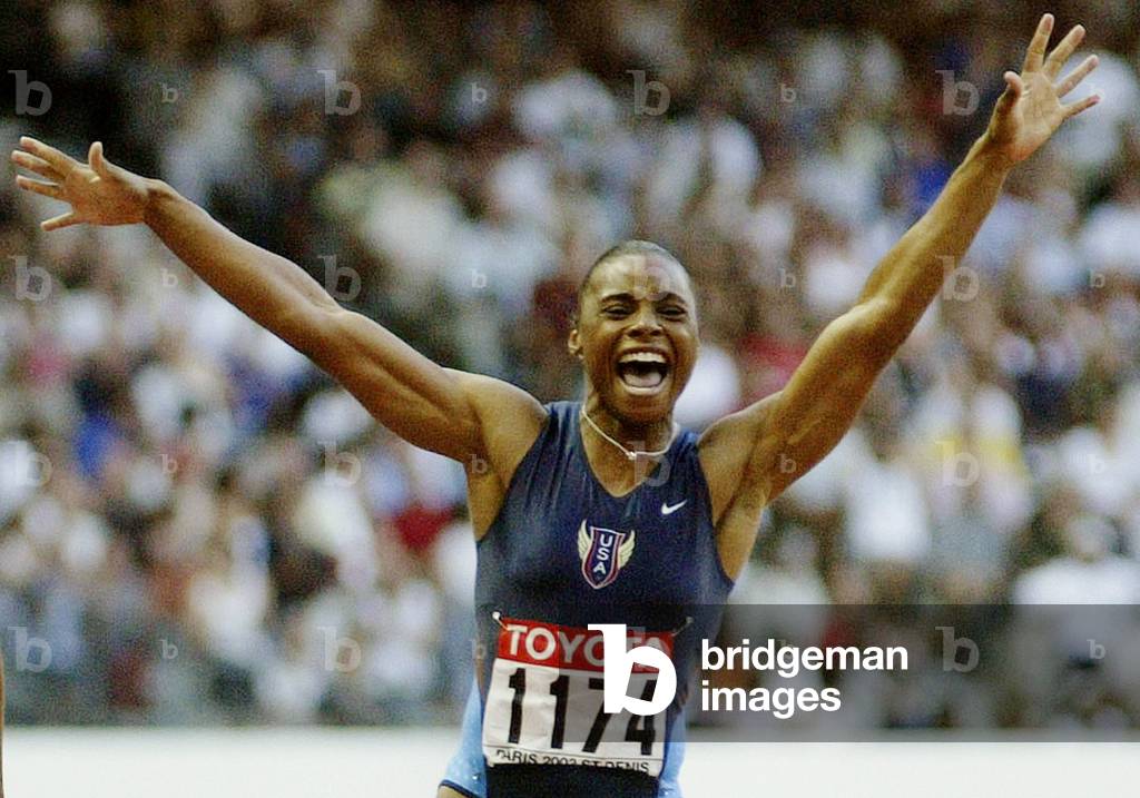 Image of KELLI WHITE OF THE U.S. WINS THE WOMEN'S 100 METRES