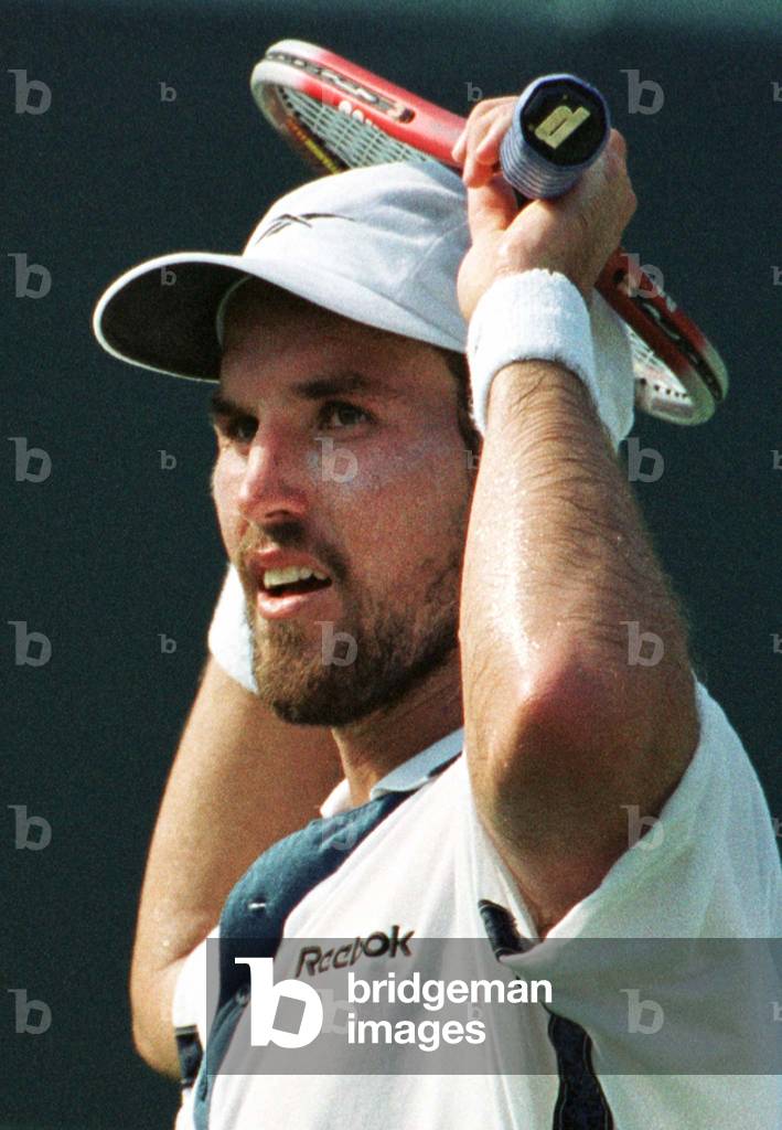 Image of PATRICK RAFTER LOOKS BACK AT CHAIR UMPIRE AT ERICSSON OPEN,