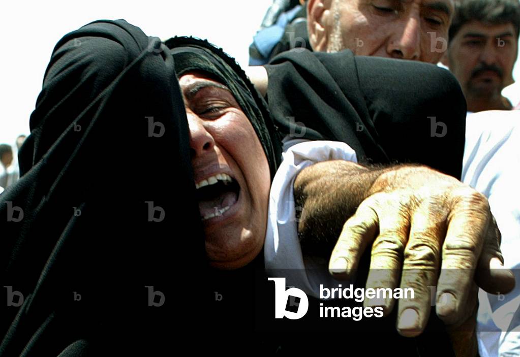 Image of BUSHRA JABBAR SCREAMS IN ANGUISH AFTER IDENTIFYING THE REMAINS OF