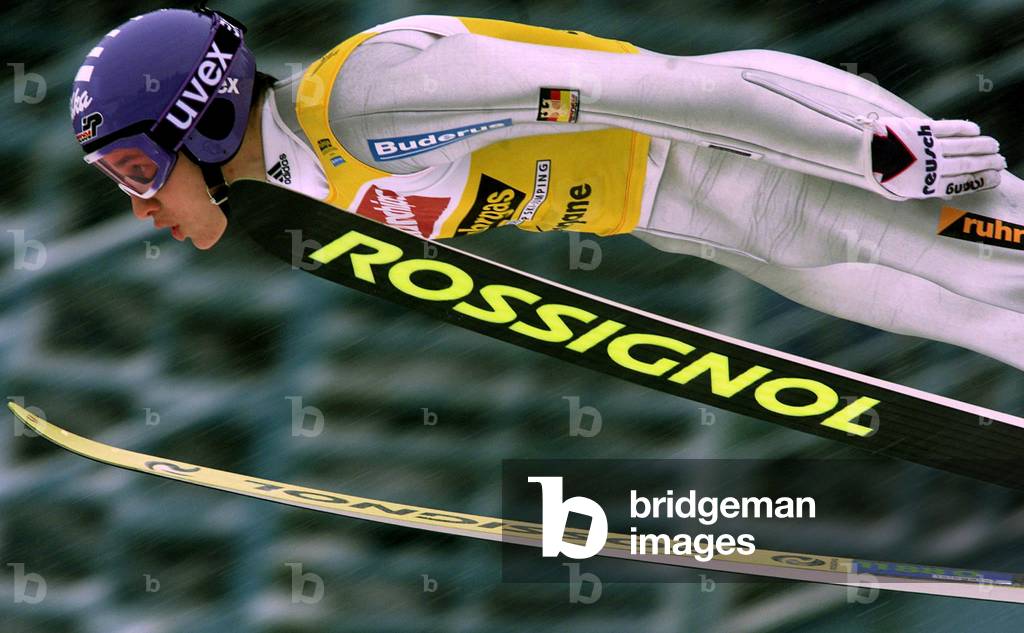 Image of German ski jumping World Cup leader Martin Schmitt soars through
