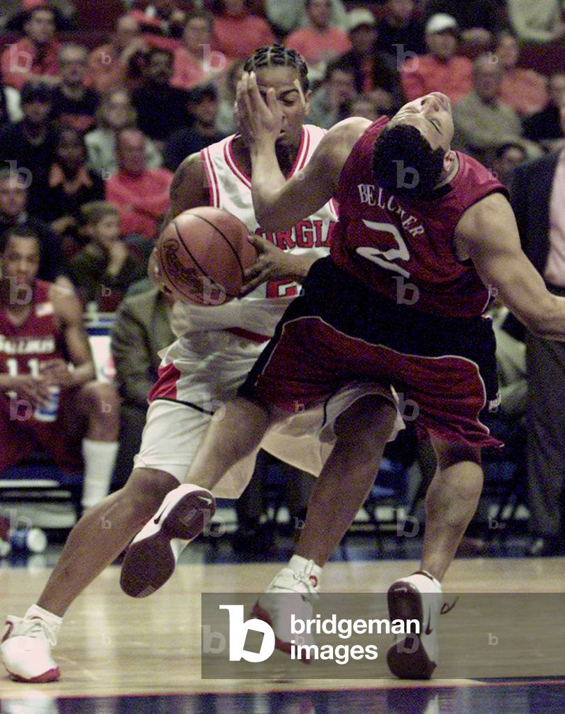 Image of GEORIGIAS DEAN FOULS SOUTHERN ILLINOIS BELCHER ON WAY TO BASKET,
