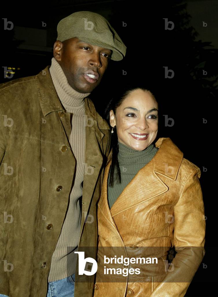 Image of Actress Jasmine Guy and husband Terrence Duckette pose as they
