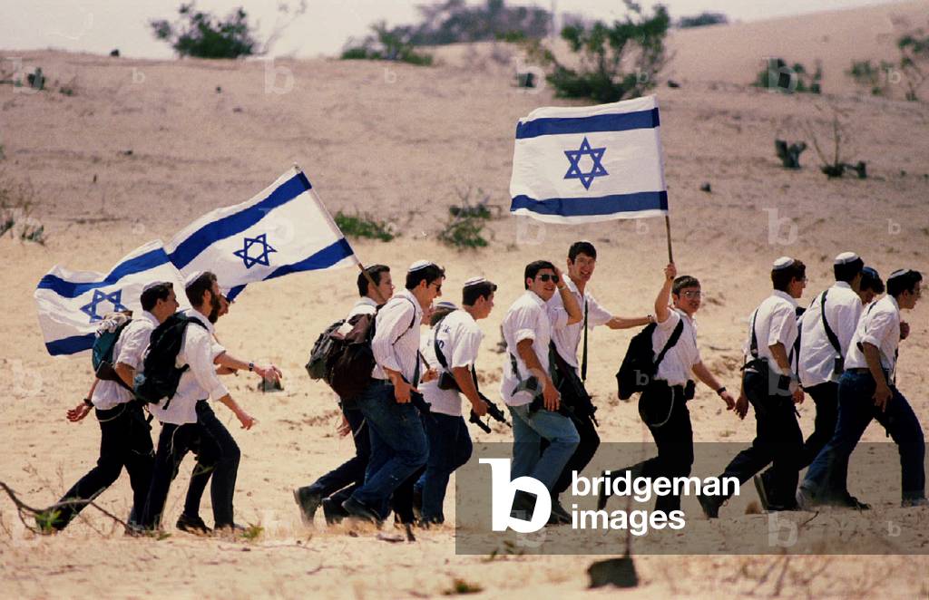 Image of Right-right Jewish settlers, most of whom carry Uzi submachine ...