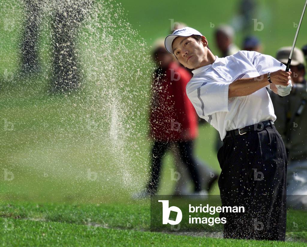 Image of TANAKA SHOOTS OUT OF A BUNKER DURING FINAL ROUND OF