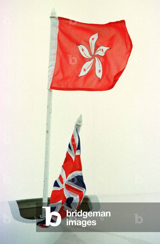 Image of THE HONG KONG FLAG IS HOISTED ON THE PLANE UPON