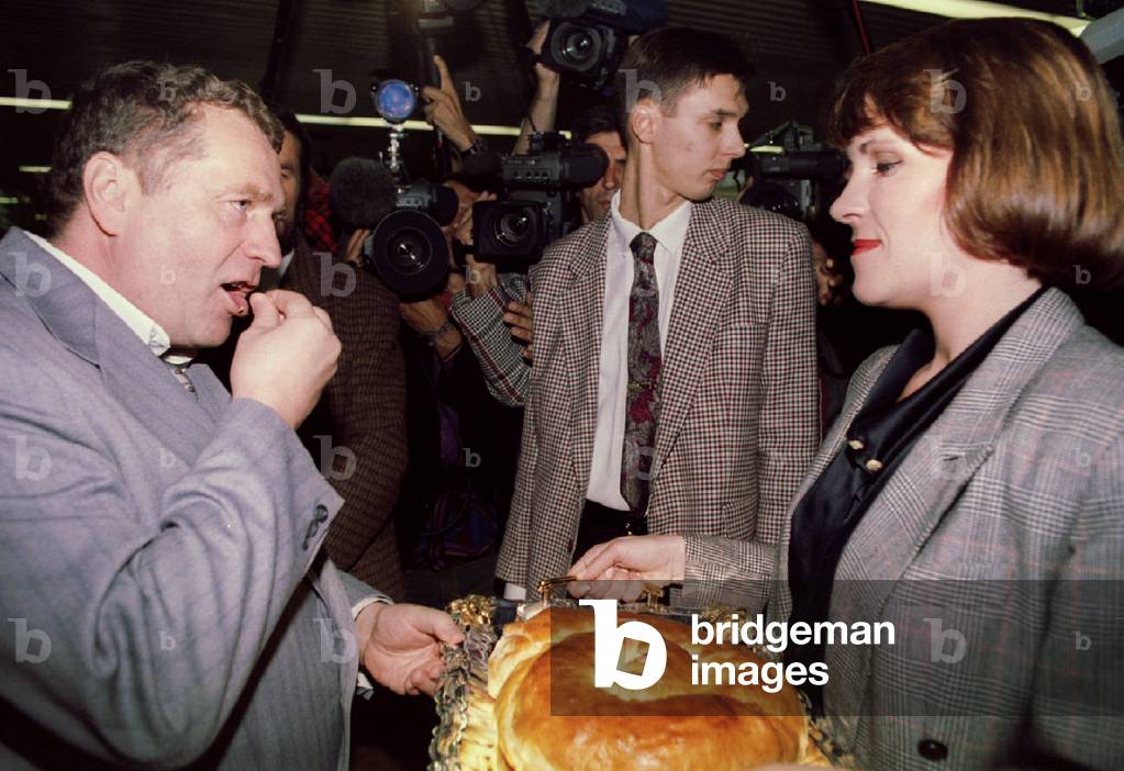 Image of Russian ultranationalist Vladimir Zhirinovsky (L) takes bread ...